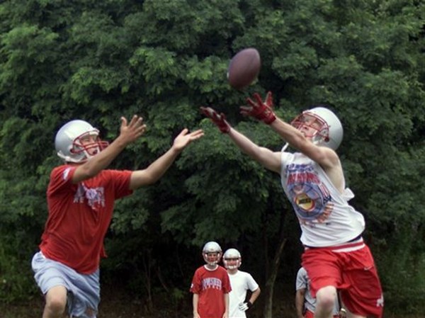 Breaking huddle: High School practice begins | The Blade