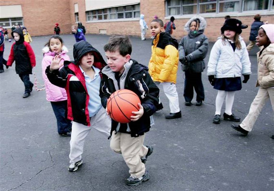 Kids Playing Basketball At Recess