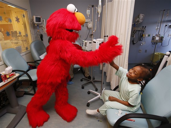 Elmo visits hospital patients | The Blade