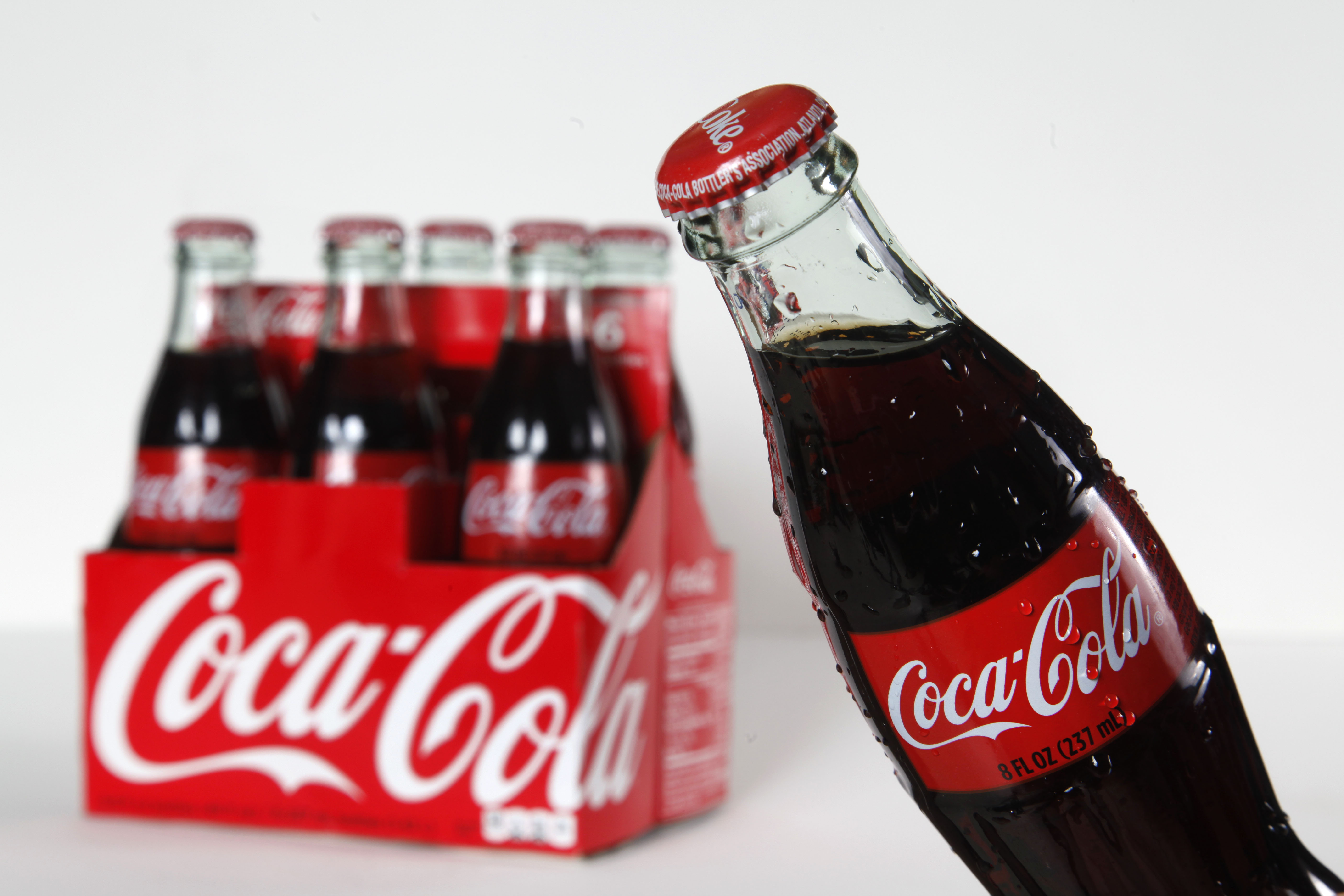 Coca-Cola sells more drinks but soda dips; profit declines 8 percent in ...