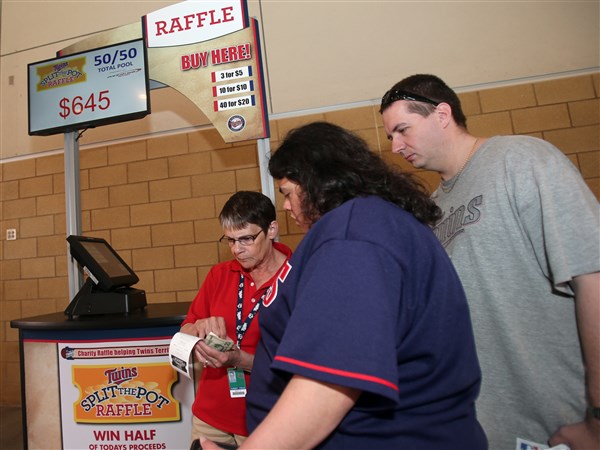 Sports teams sell raffle tickets in stands for charity | The Blade