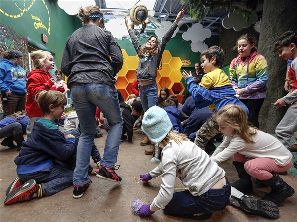 Students play opossum at the zoo on day off school | The Blade