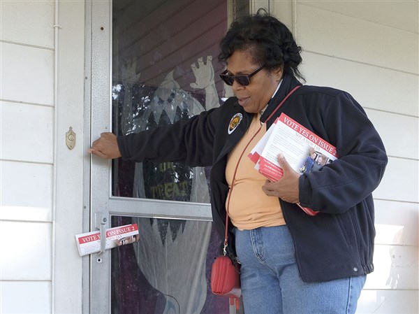 Mayor, volunteers knock on doors to reach voters | The Blade