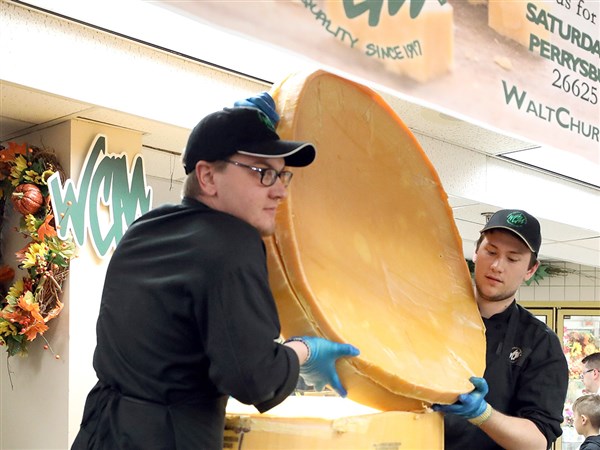 Cheesy tradition: Christmas Cheddar arrives at Walt Churchill's Market ...