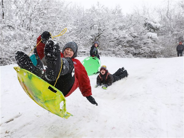 Photo gallery: Sledding through the snow | The Blade