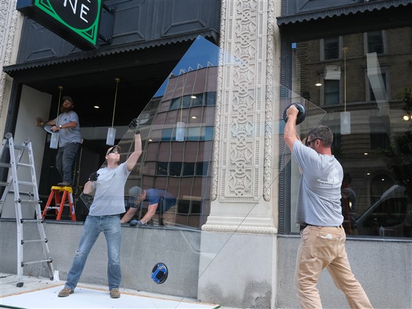 Workers replace windows following protest vandalism | The Blade