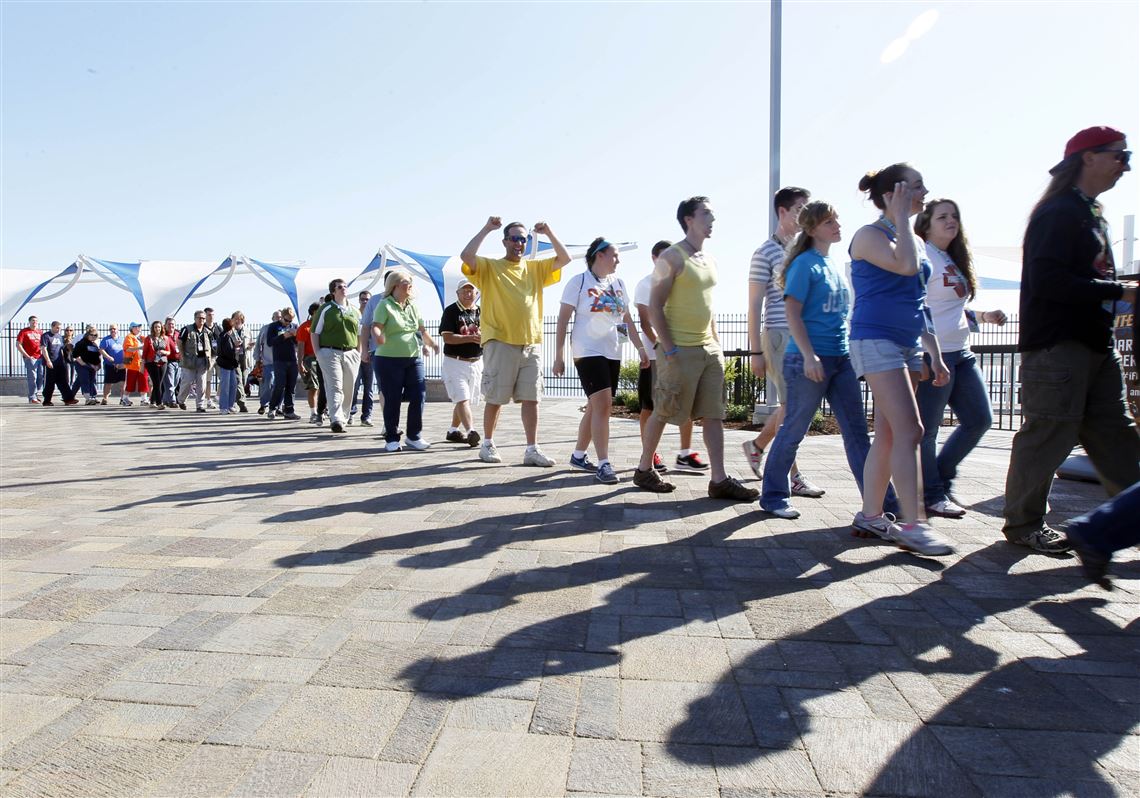 Long Line Of People At Amusement Park