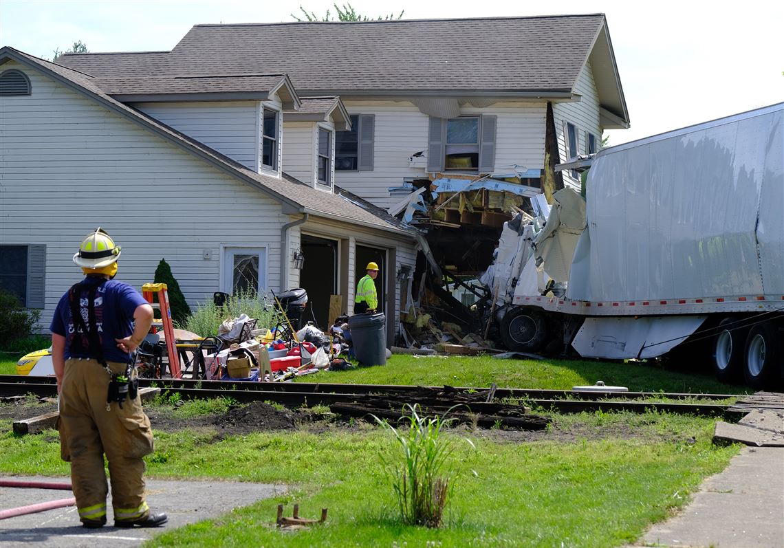 Truck Crashing Into House