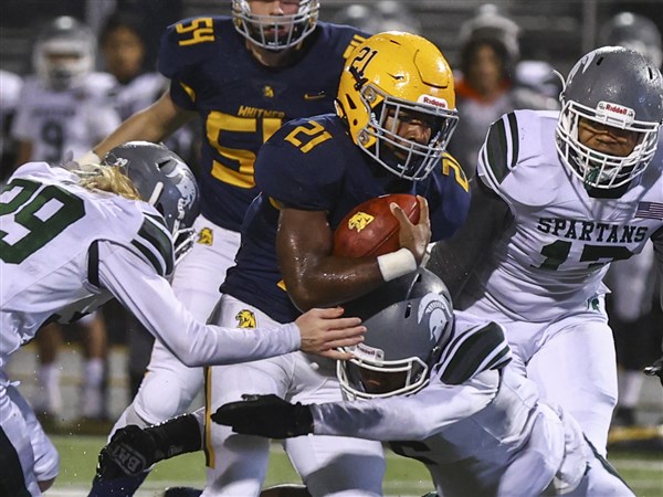 Whitmer football runs past Start in soggy playoff opener | The Blade