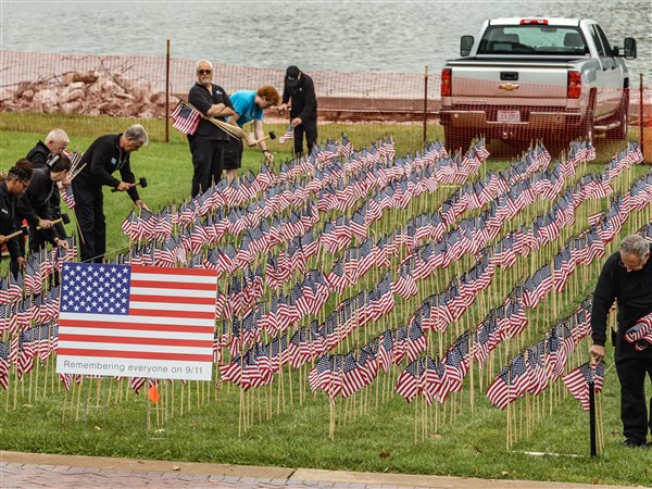Imagination Station honors 9/11 by placing over 2,000 flags in Festival ...