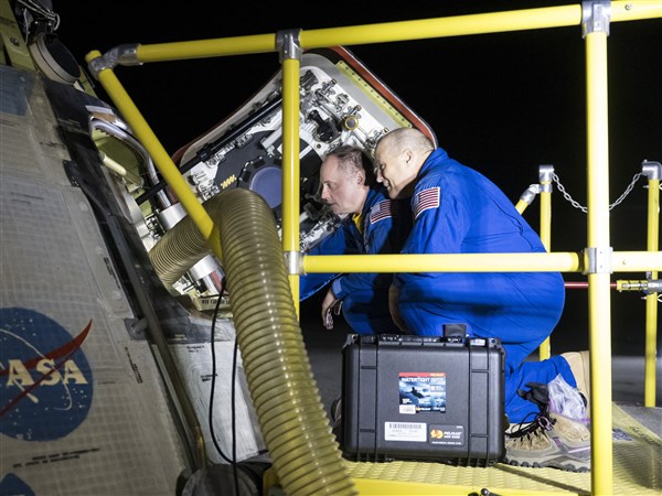Astronauts left behind in space as Boeing's capsule returns to Earth ...